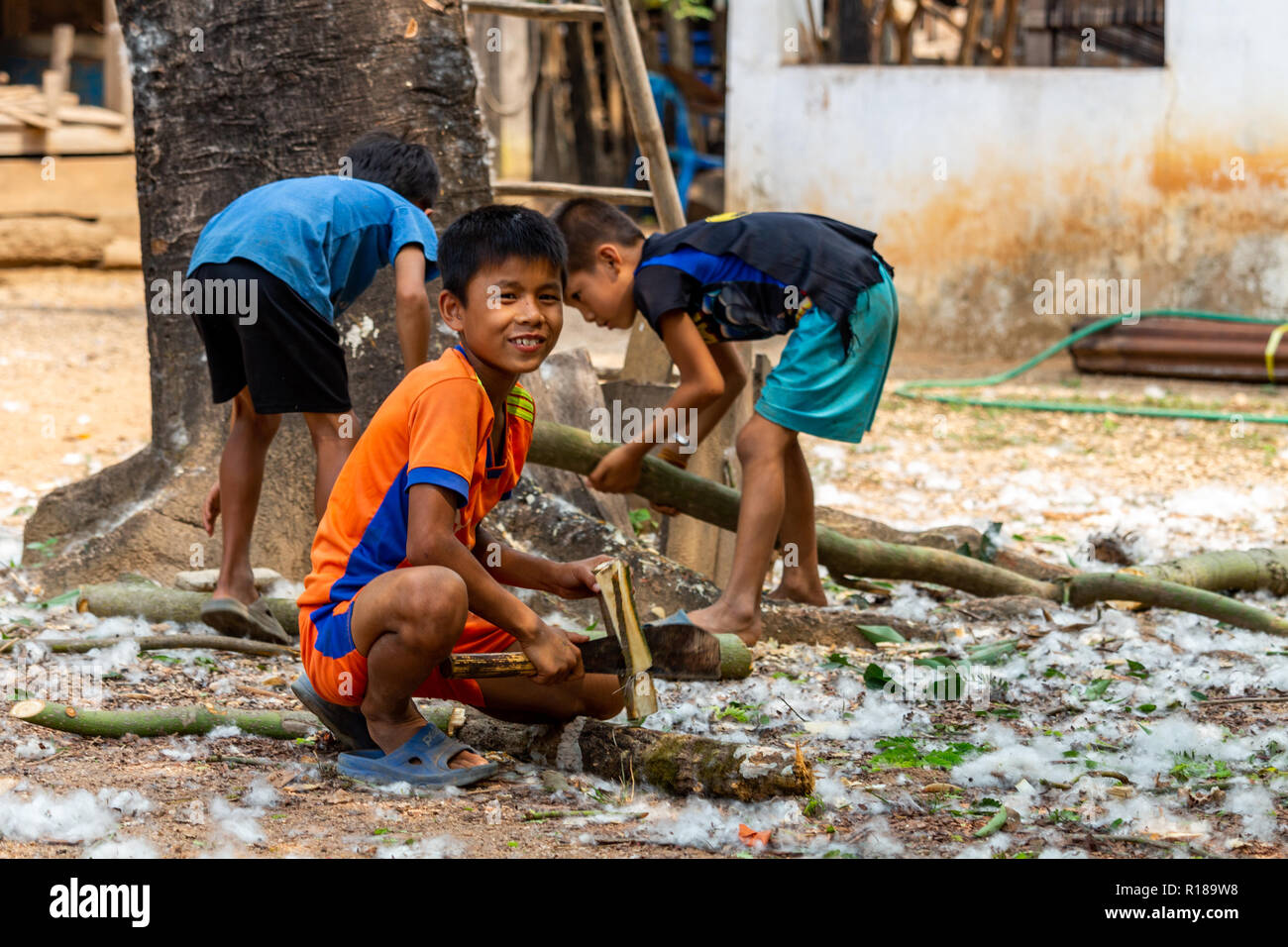 Thakhek, Laos - April 21 2018: Children working with woods in a remote ...
