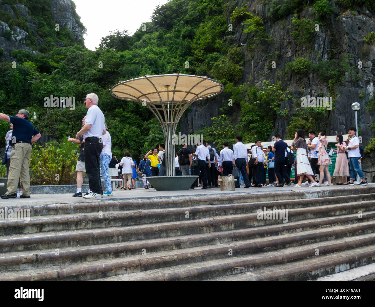 Tourists off junk cruise boats to visit one of caves in limestone ...