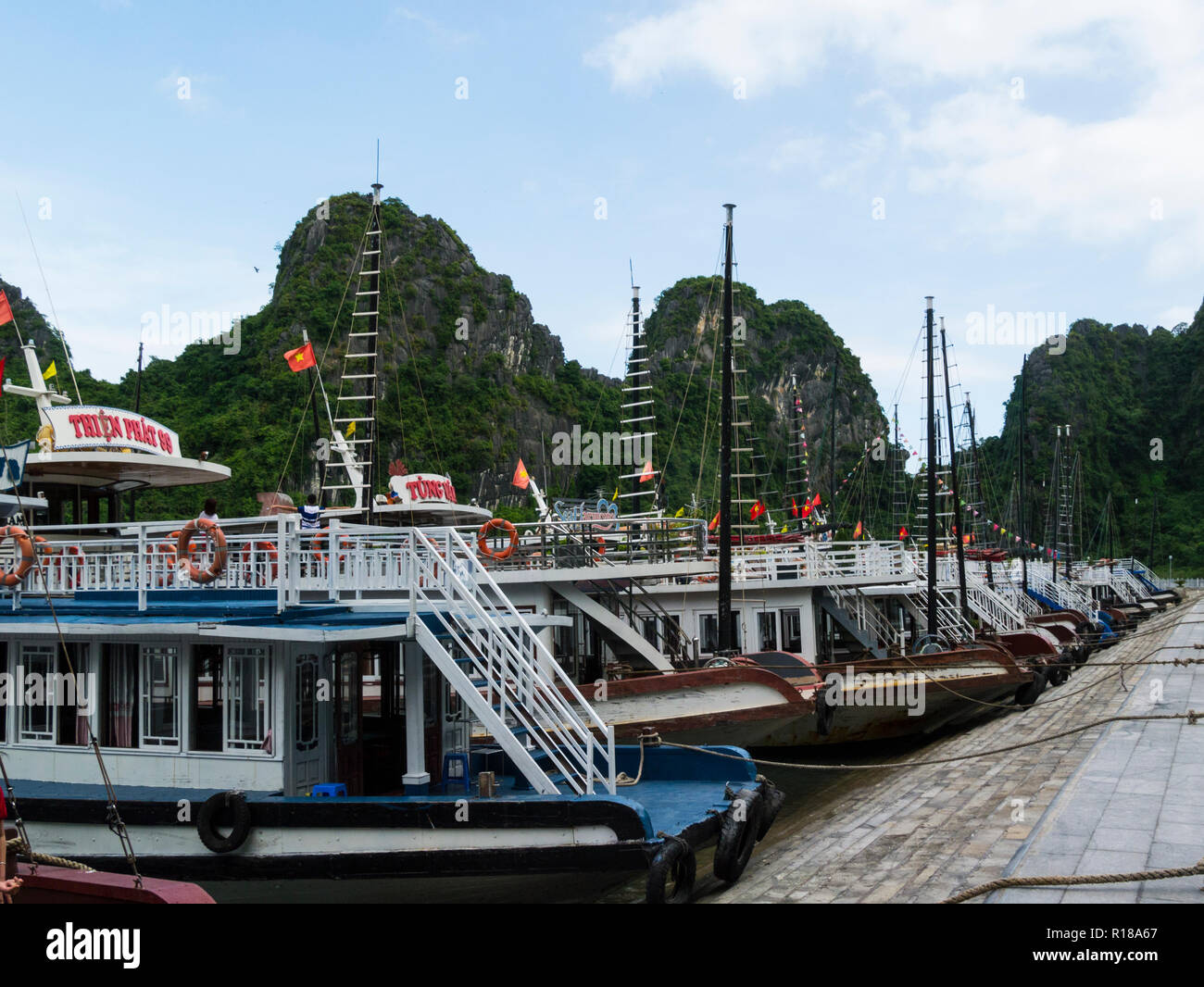 Junk Cruise boats moored for tourists to visit cave in limestone island ...