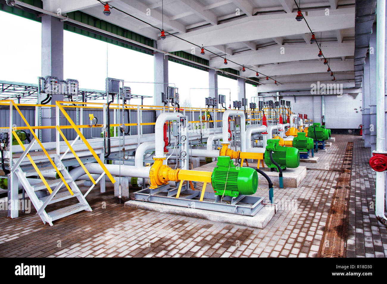 pumping equipment at the modern oil tank farm Stock Photo - Alamy