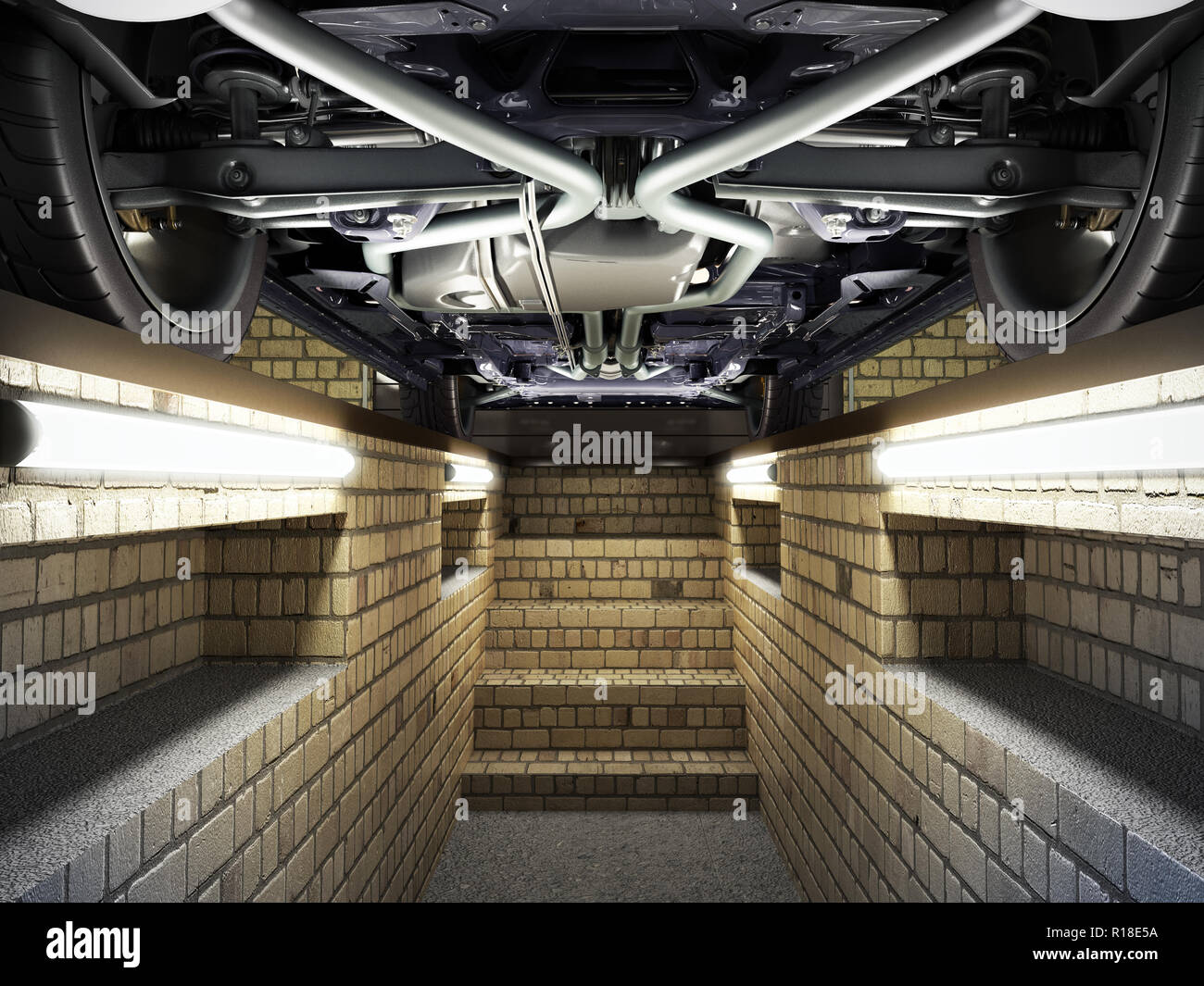 concept of car service car view from below from the pit of the garage ...