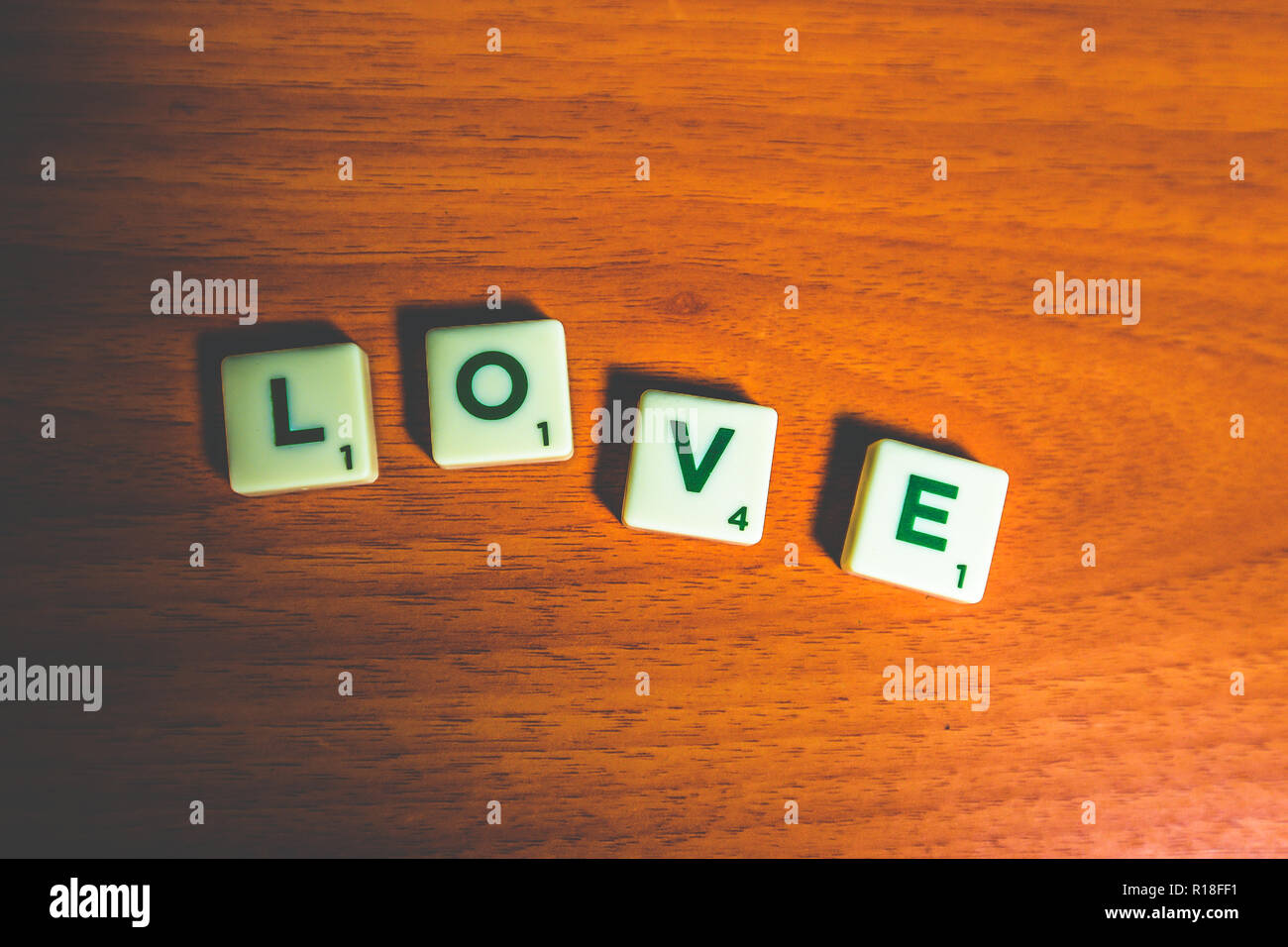 The word love spelled out in scrabble pieces Stock Photo - Alamy