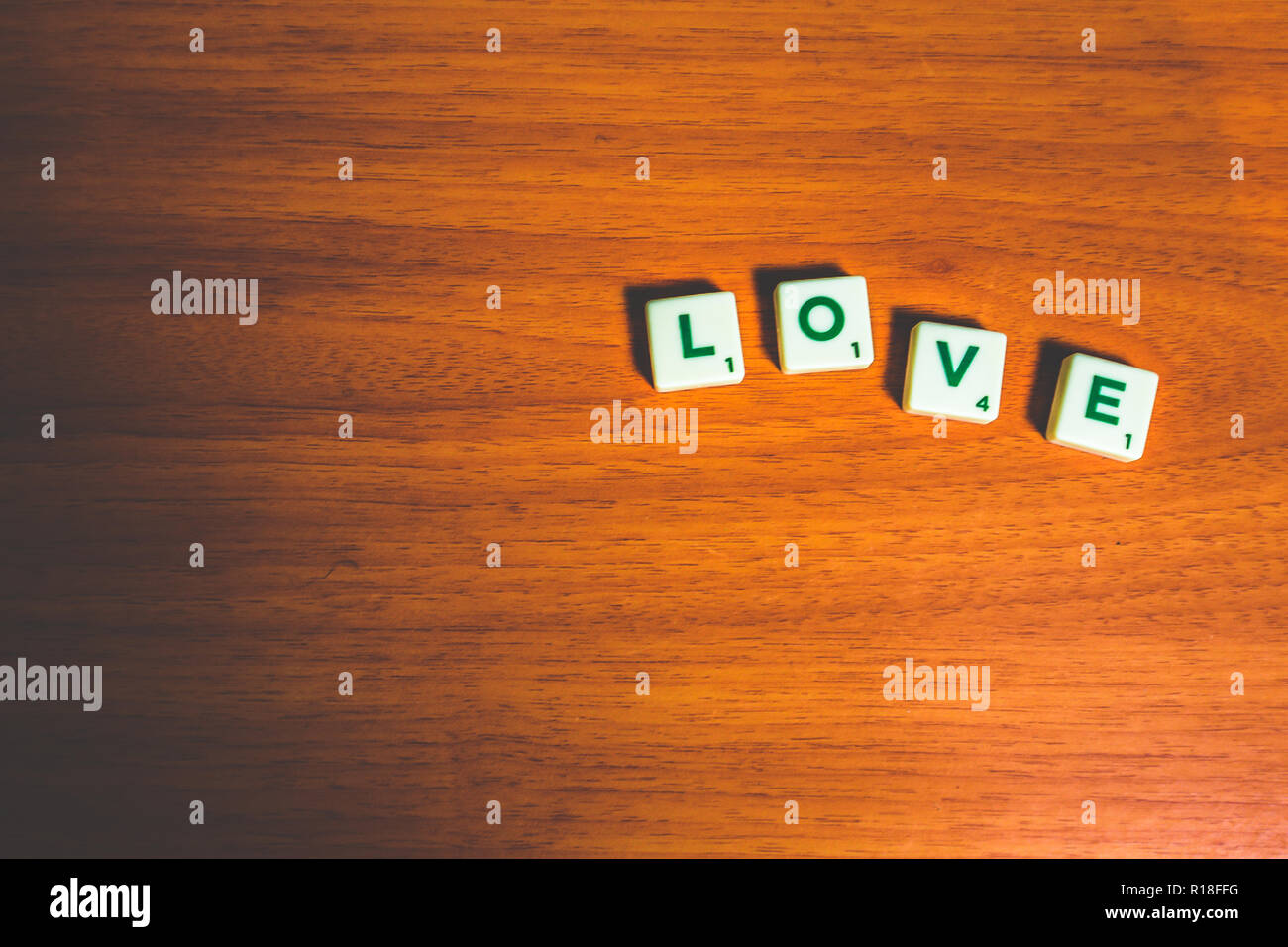 Love in scrabble letters hi-res stock photography and images - Alamy