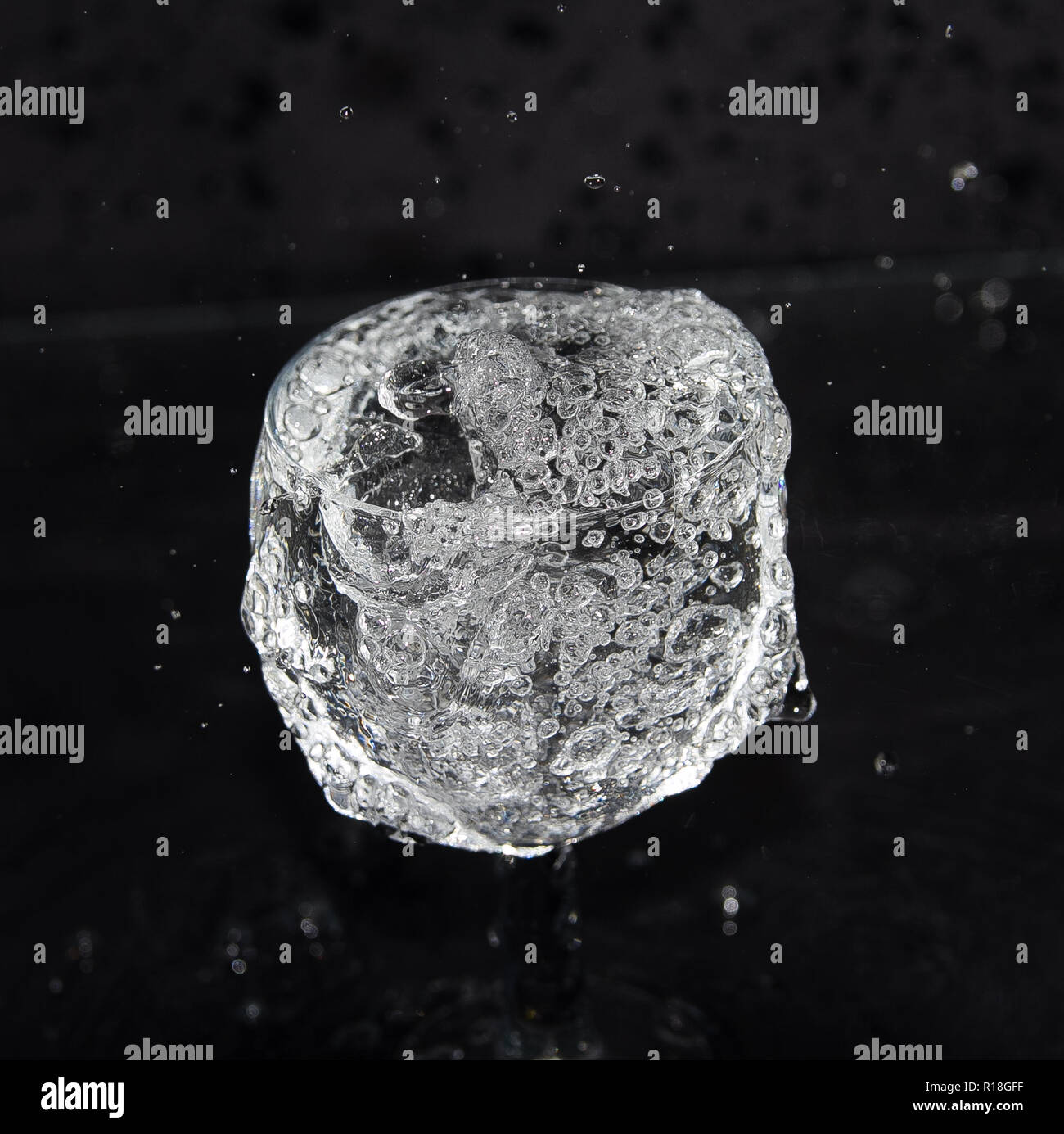 squirt, splash of water on a black background, drops Stock Photo - Alamy