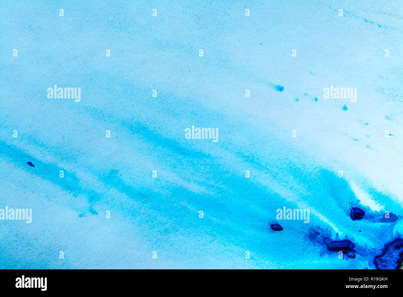 Blue paint watercolor dried on a piece of paper. Stains of blue paint ...