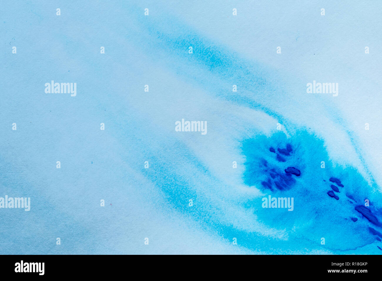 Blue paint watercolor dried on a piece of paper. Stains of blue paint ...