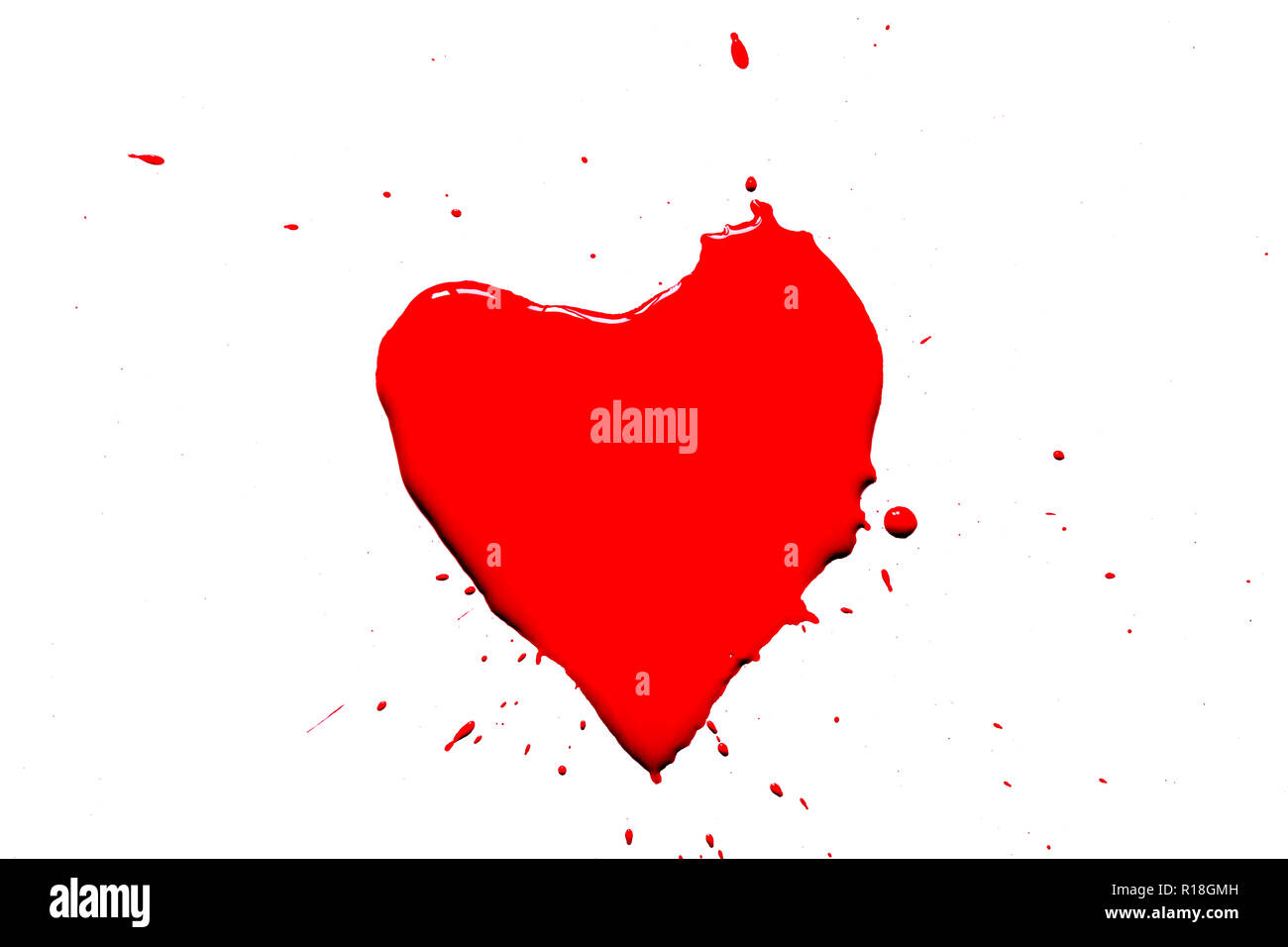 Heart symbol painted with red paint with splashes around isolated on ...