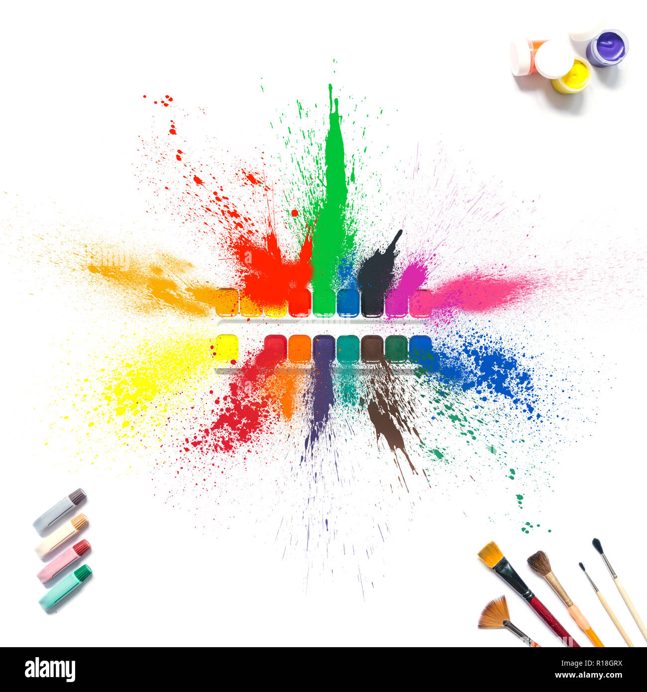 A spray splashes of colored paints from a set for drawing. Paint ...