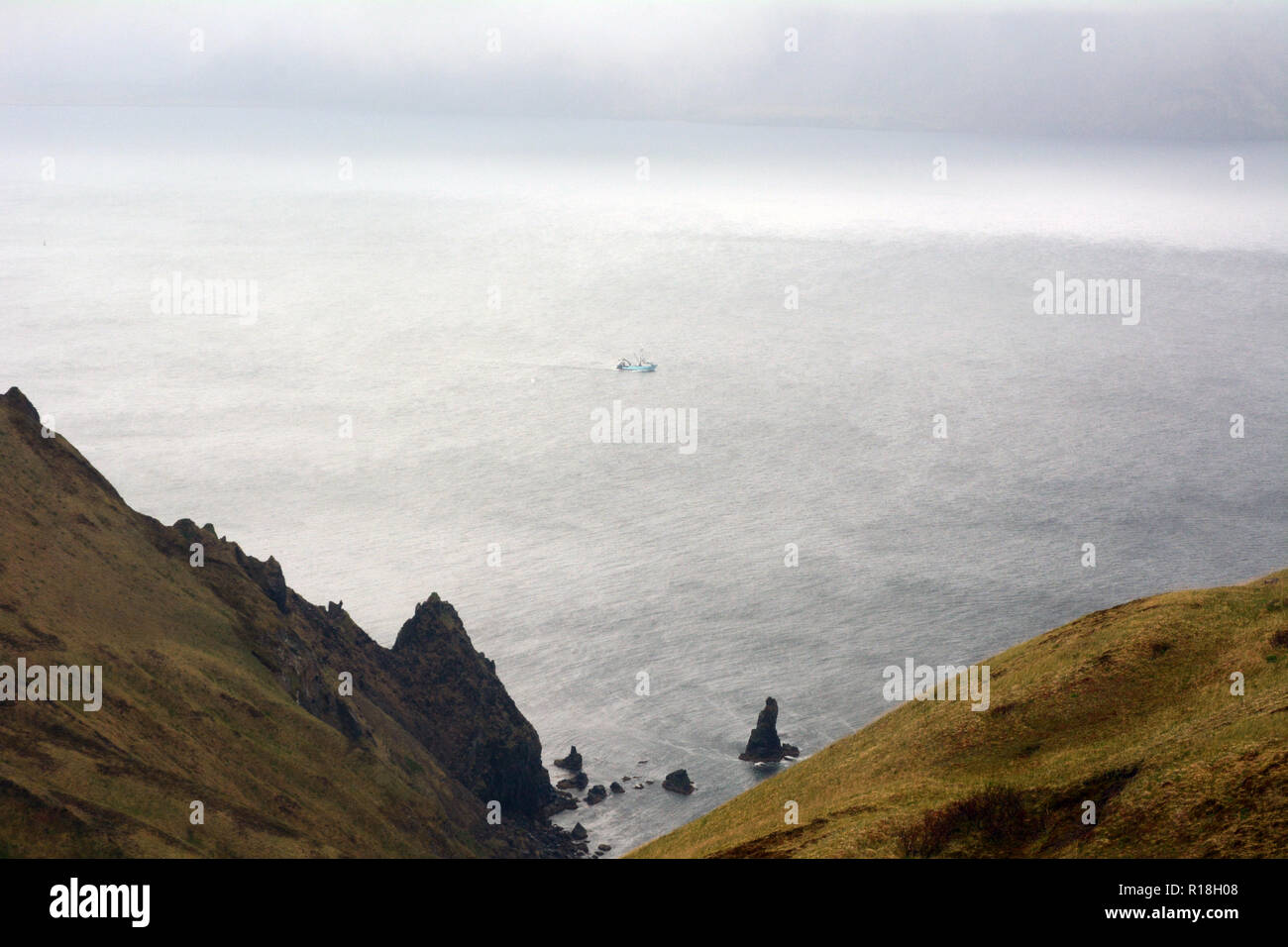 A commercial fishing boat plods the waters of the Being Sea off ...