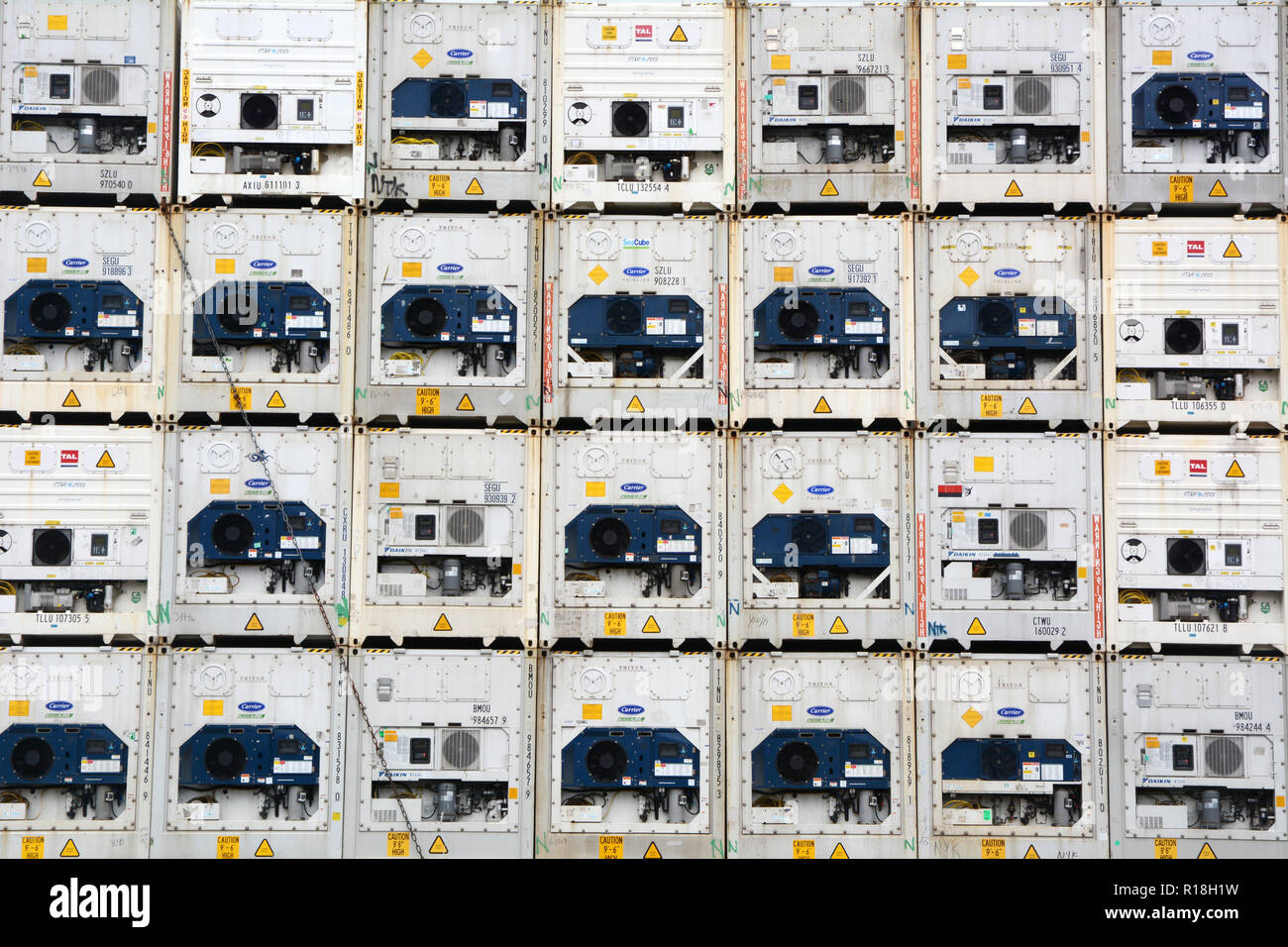 A stack of refrigerated seafood shipping containers at a depot in the ...