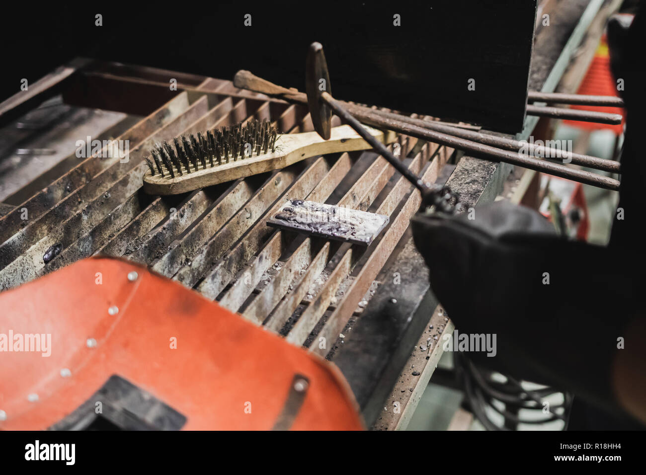 Asian engineering student doing metal work in workshop class using ...