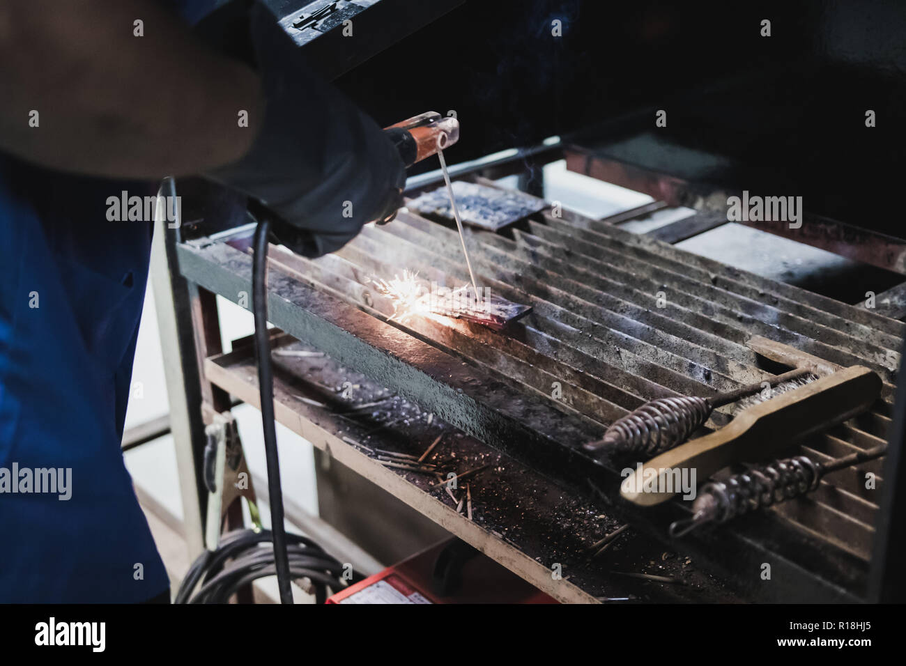 Thai Engineering student perform electric metal welding on the ...