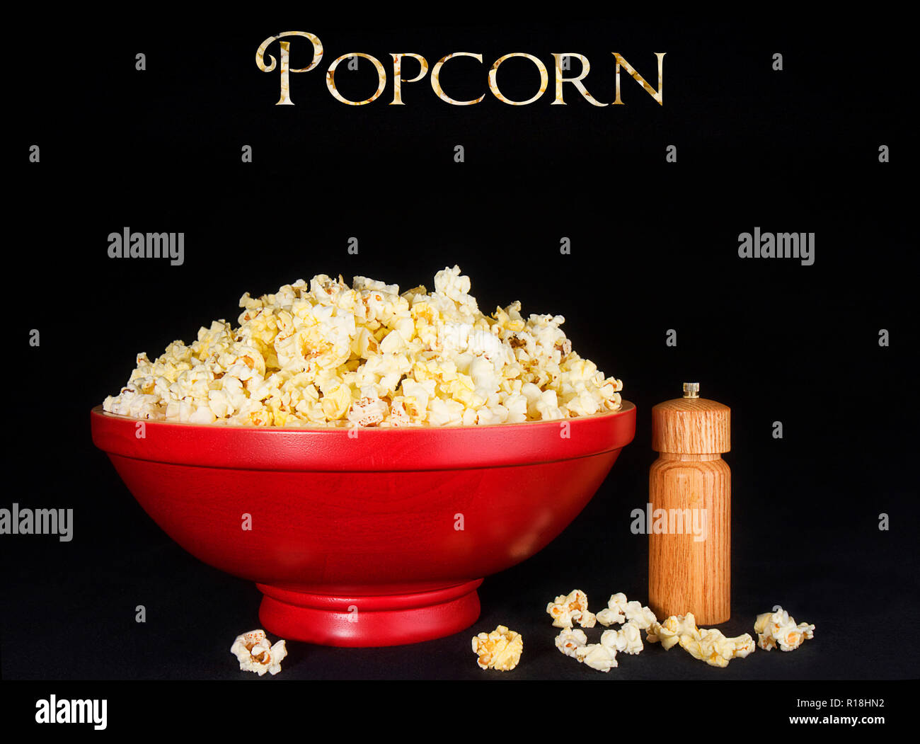 Large red wooden bowl of popcorn isolated on black background Stock ...