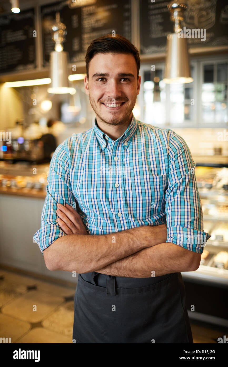 Smiling waiter standing behind hi-res stock photography and images - Alamy