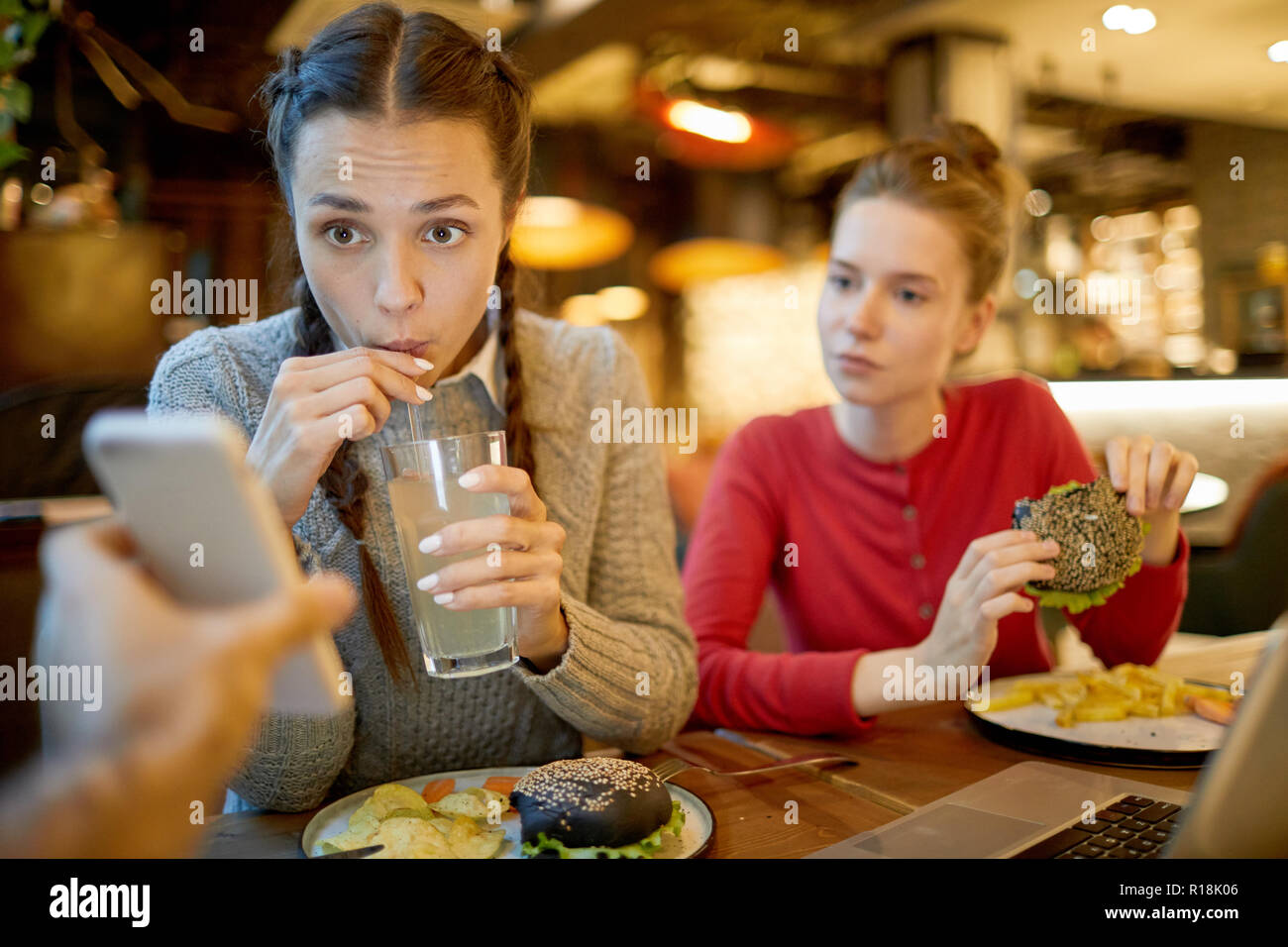 Sipping drink through straw hi-res stock photography and images - Alamy