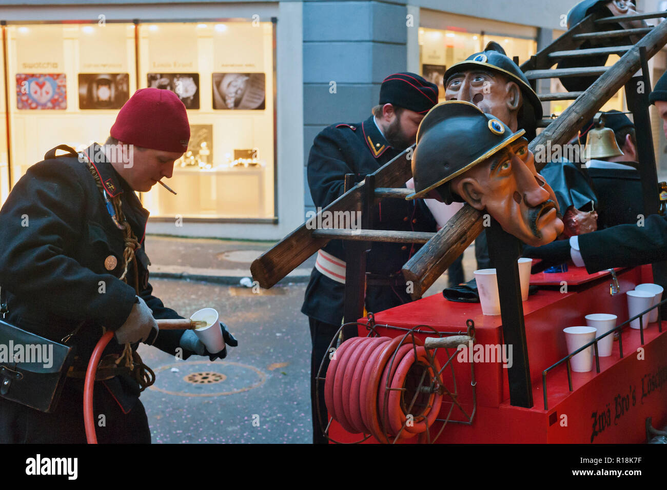 people wearing a carnival costumes of firefighter at Luzern Carnival ...