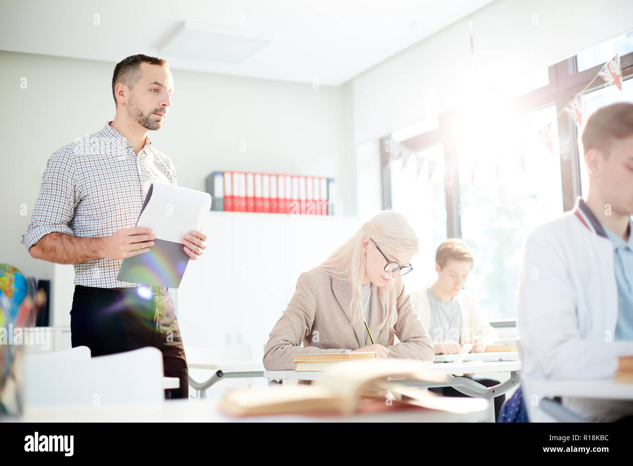 Teacher walking out classroom hi-res stock photography and images - Alamy