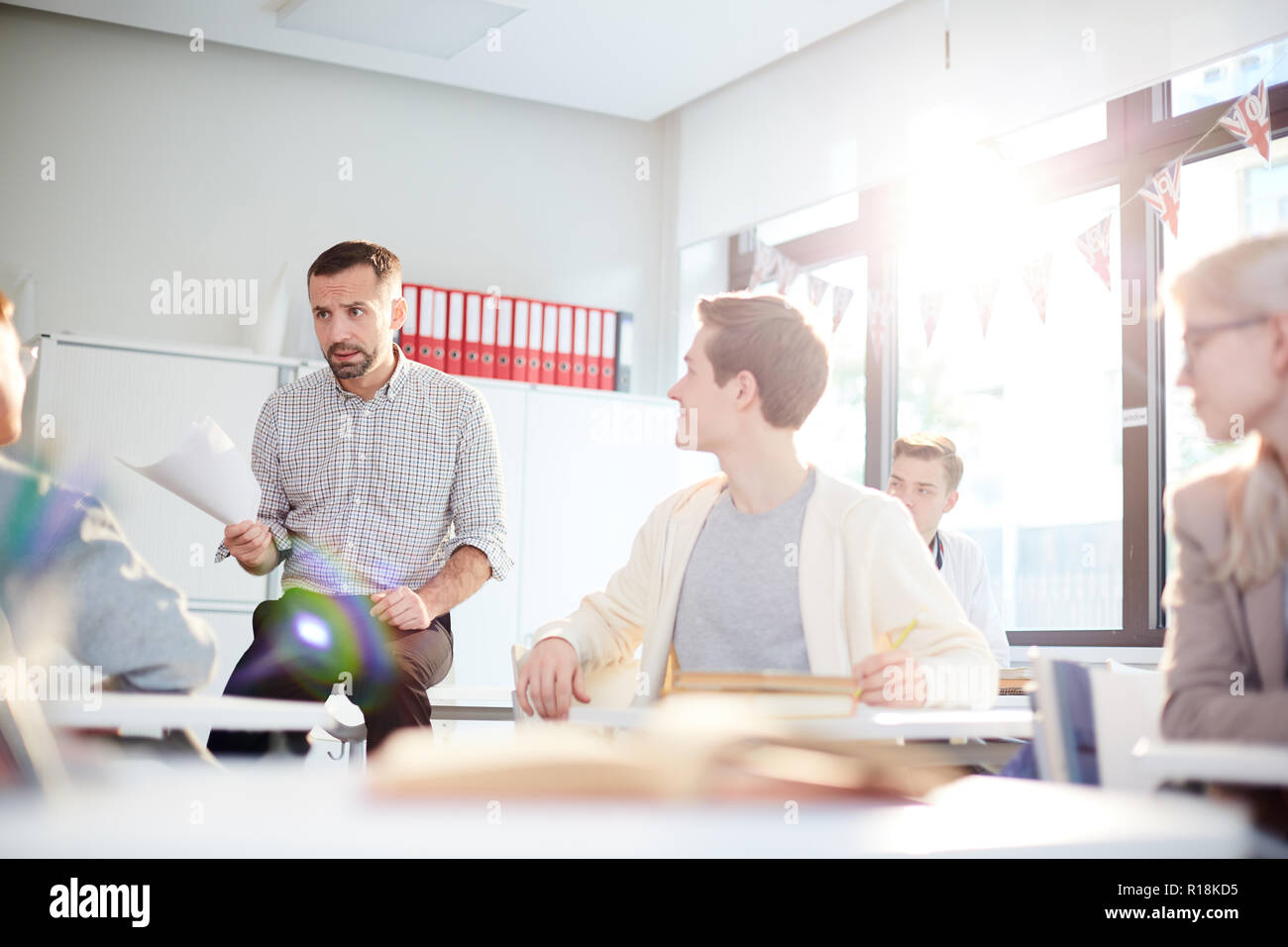 Serious teacher young with students hi-res stock photography and images ...
