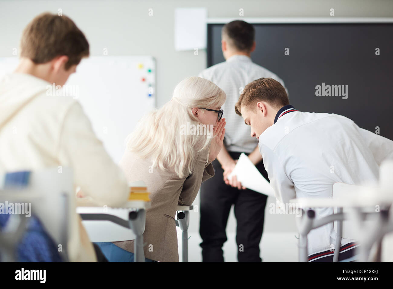 Teacher behind back secret hi-res stock photography and images - Alamy