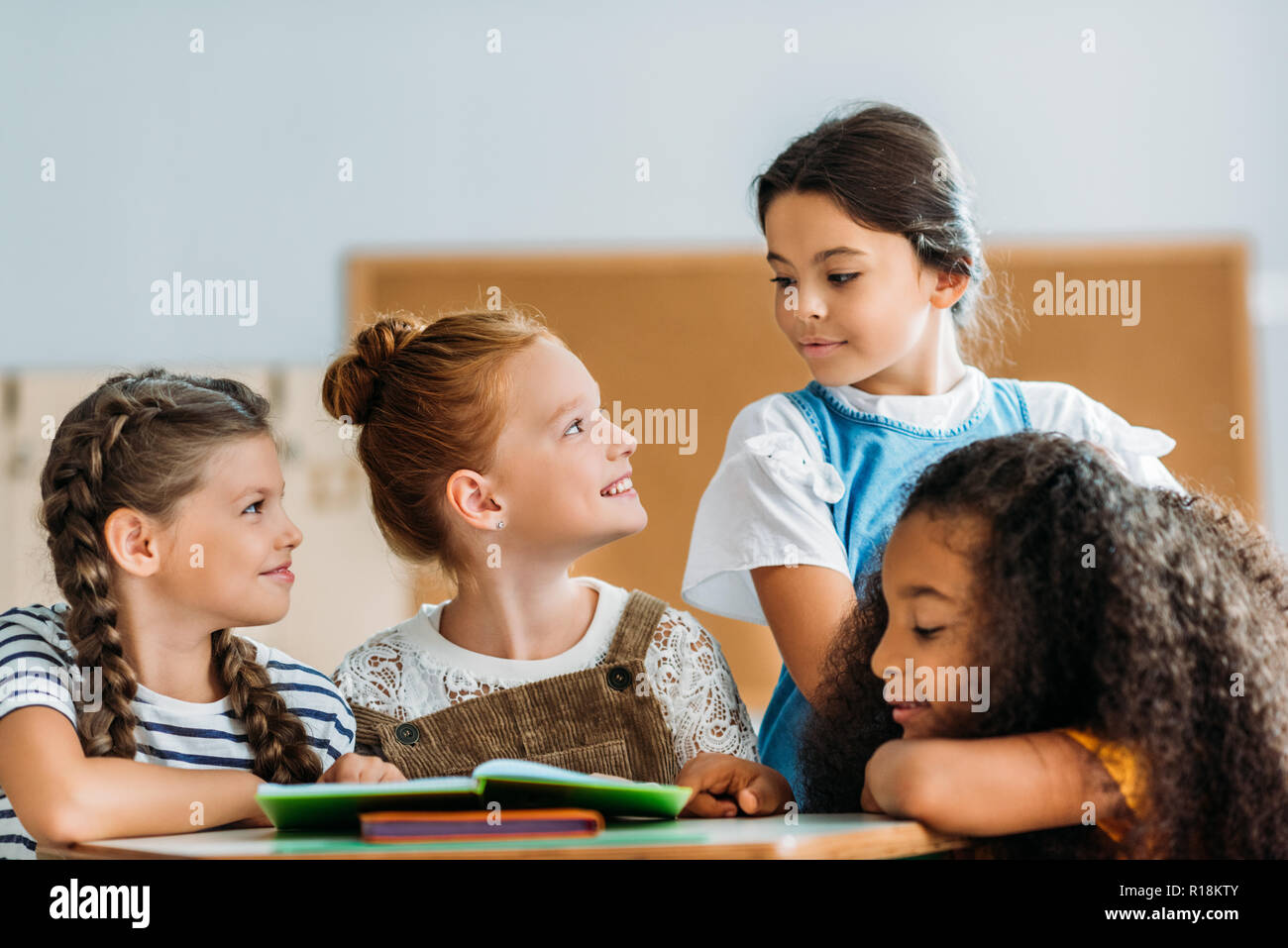 Girls chatting during class hi-res stock photography and images - Alamy