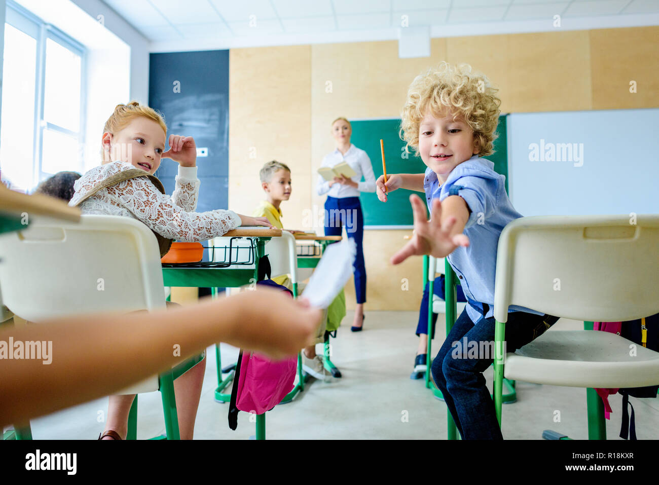 Woman passing note hi-res stock photography and images - Alamy