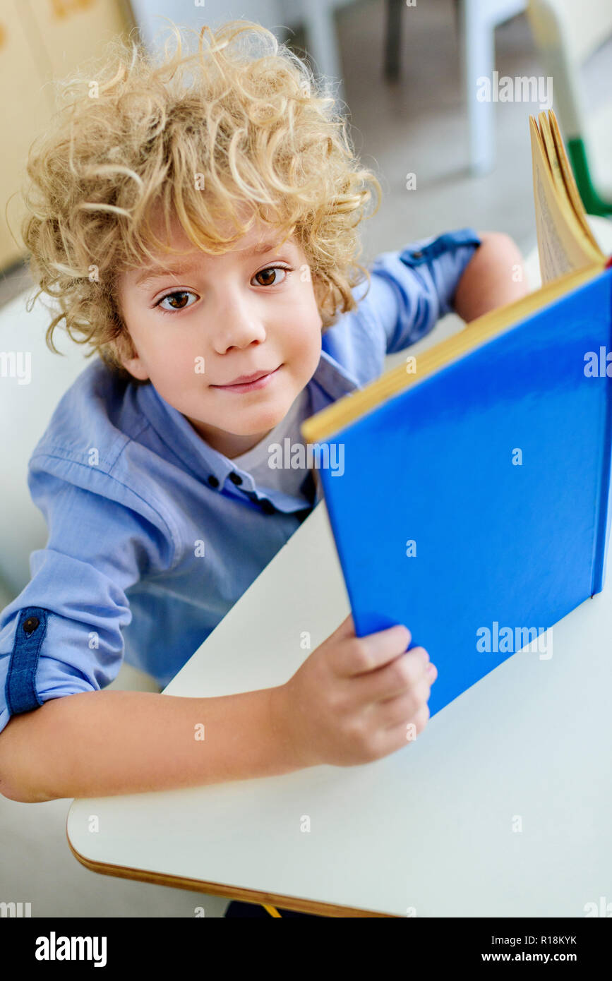 Portrait schoolboy reading book hi-res stock photography and images - Alamy