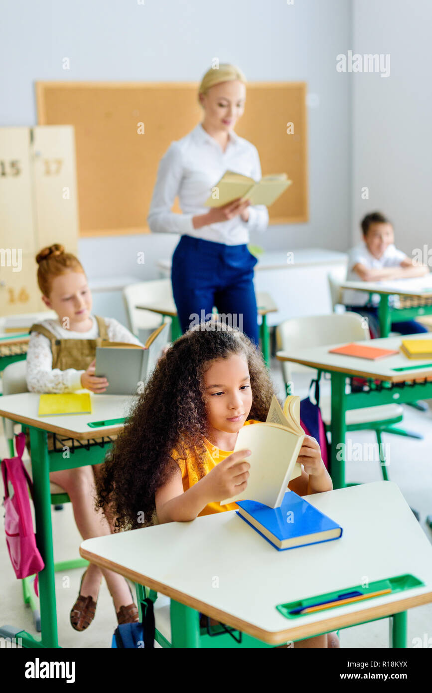 Female teacher pupils during lesson hi-res stock photography and images ...