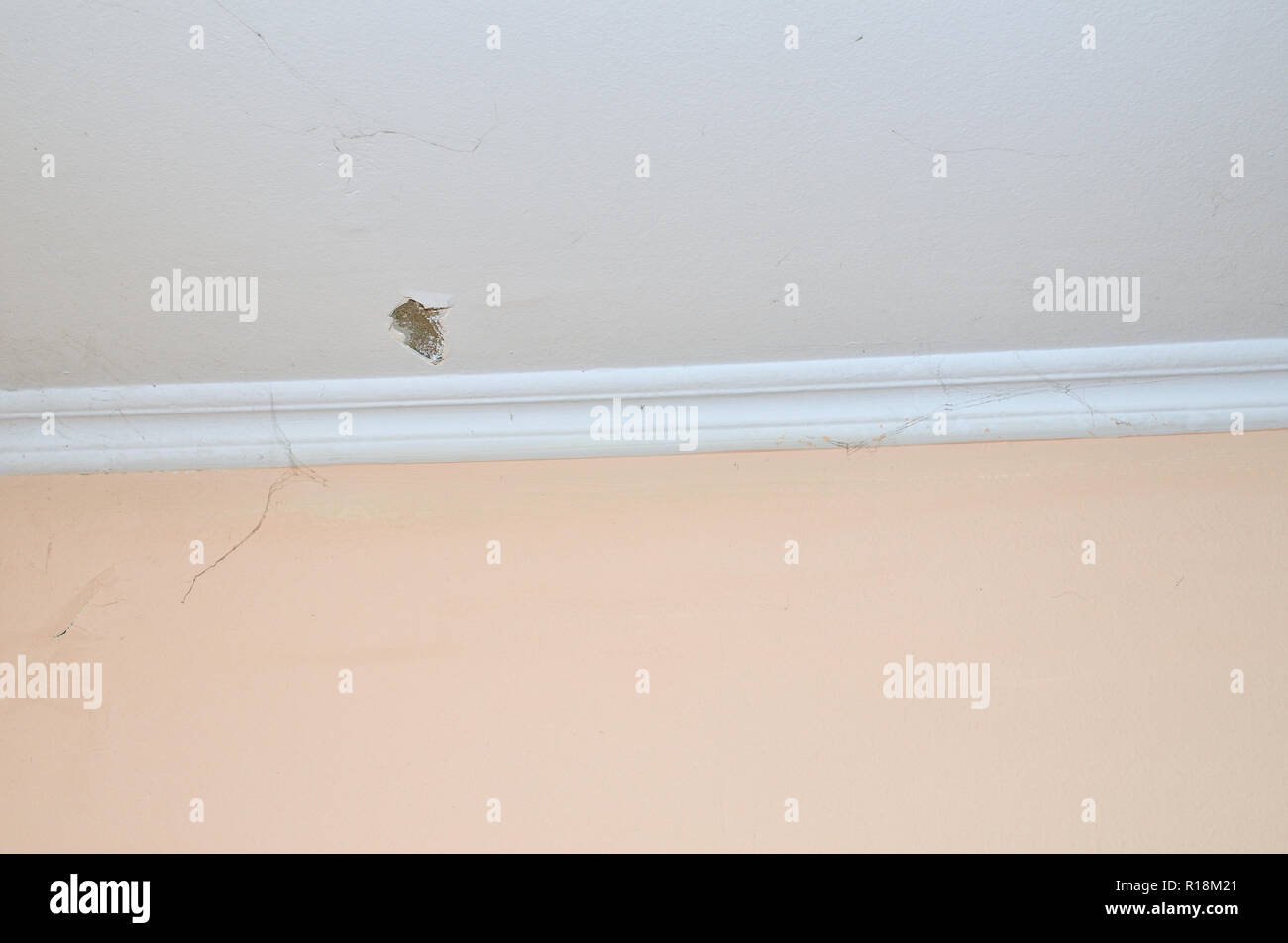 Ceiling with a crack and wall with parts of a spider web Stock Photo ...