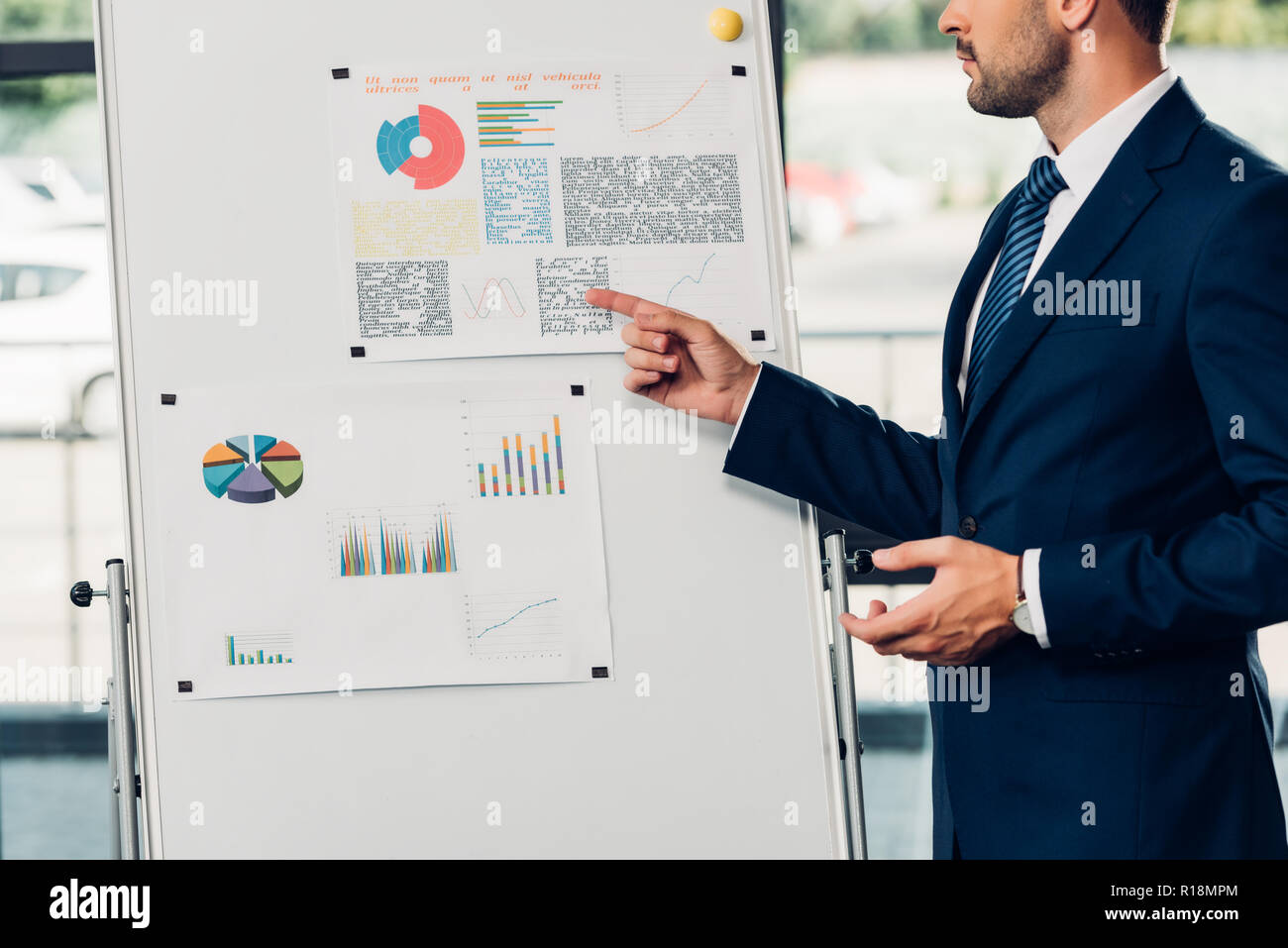 partial view of lecturer pointing at white board during presentation in ...