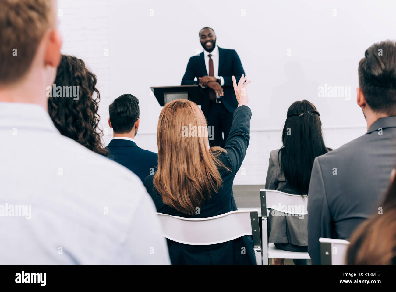 african american lecturer talking to audience during seminar in ...