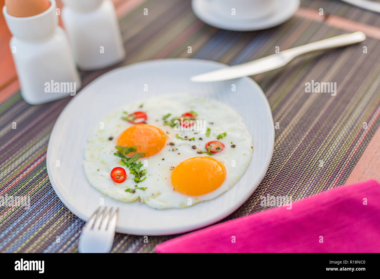 Outdoors restaurant scene, table set-up delicious breakfast for two at ...