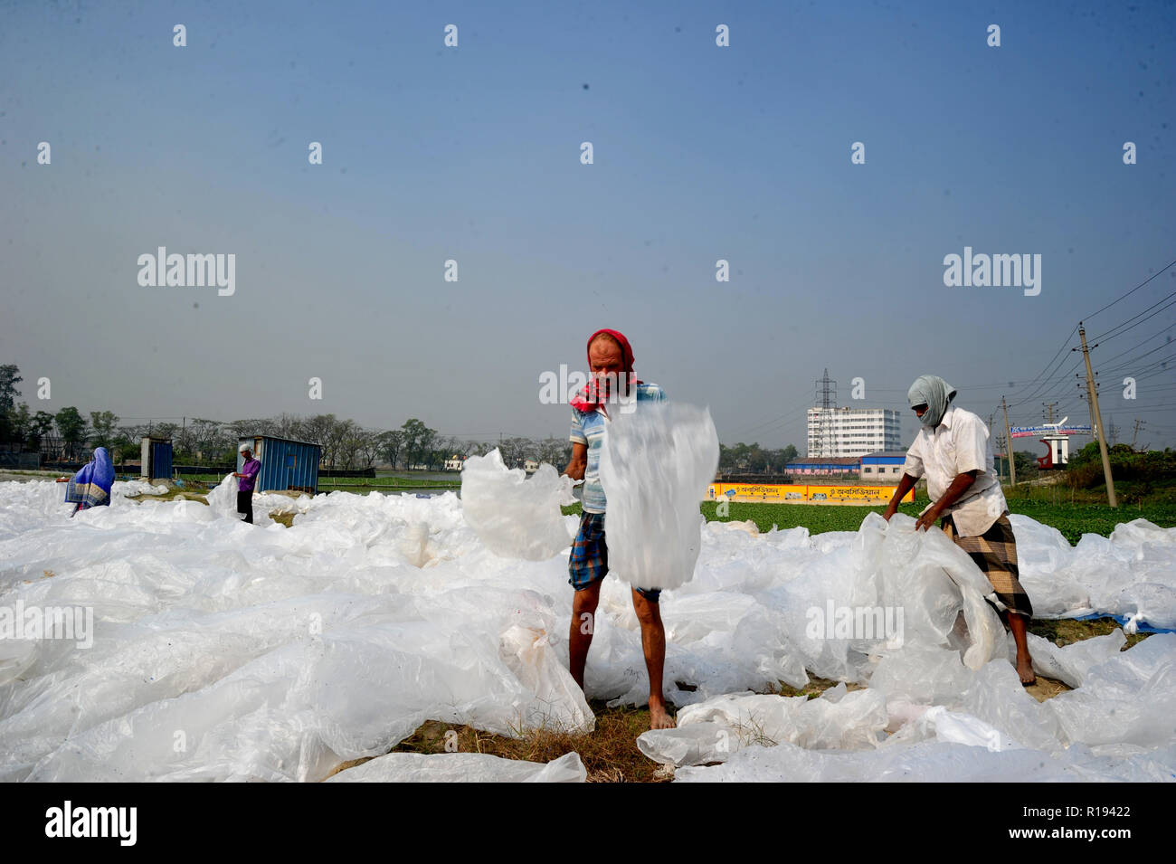 Bangladeshi workers dries reject plastic bag in Nararyanganj ...