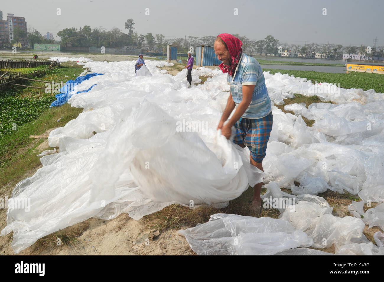 Bangladeshi workers dries reject plastic bag in Nararyanganj ...