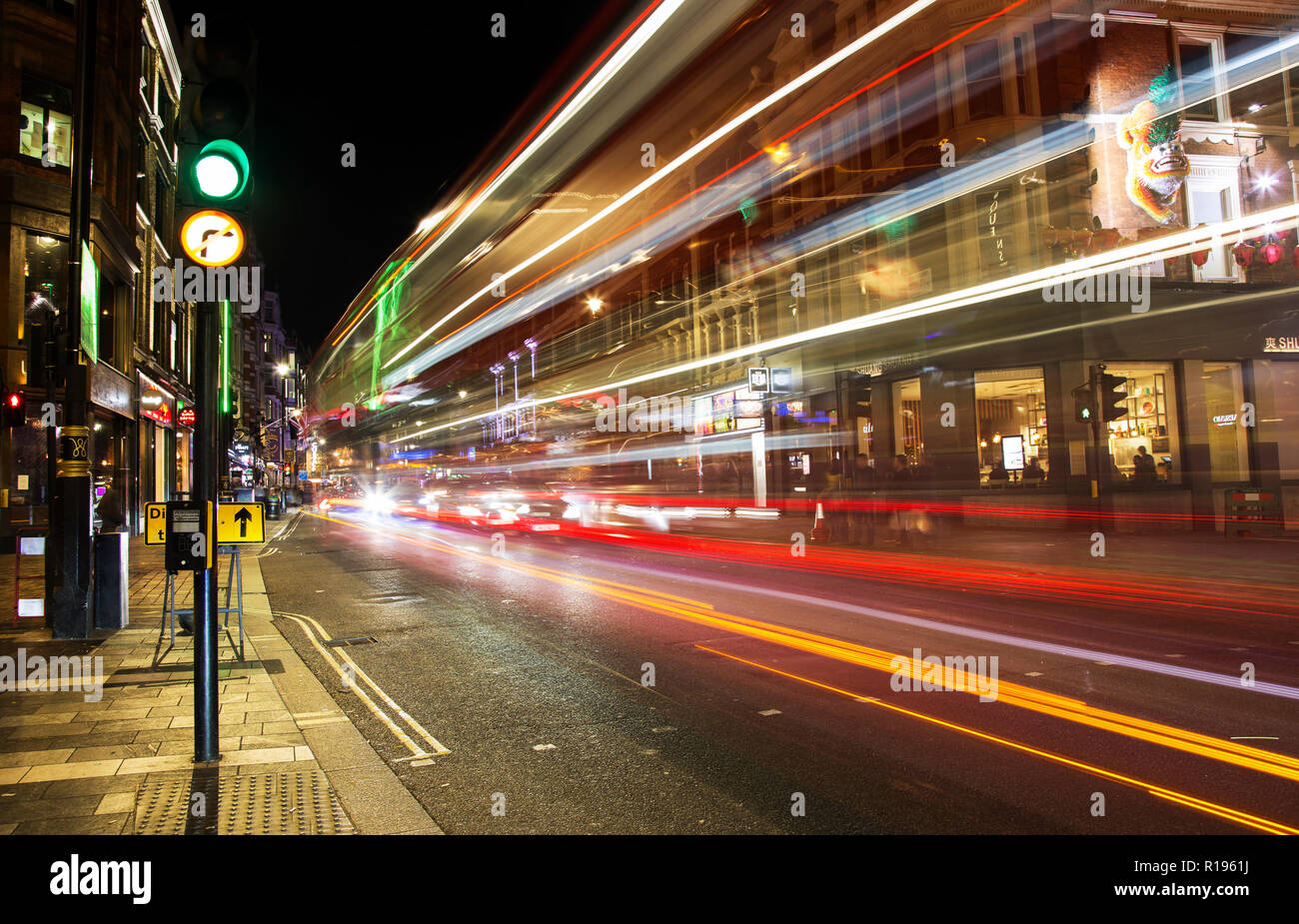 night scene of London city with moving cars and bus - long exposure ...