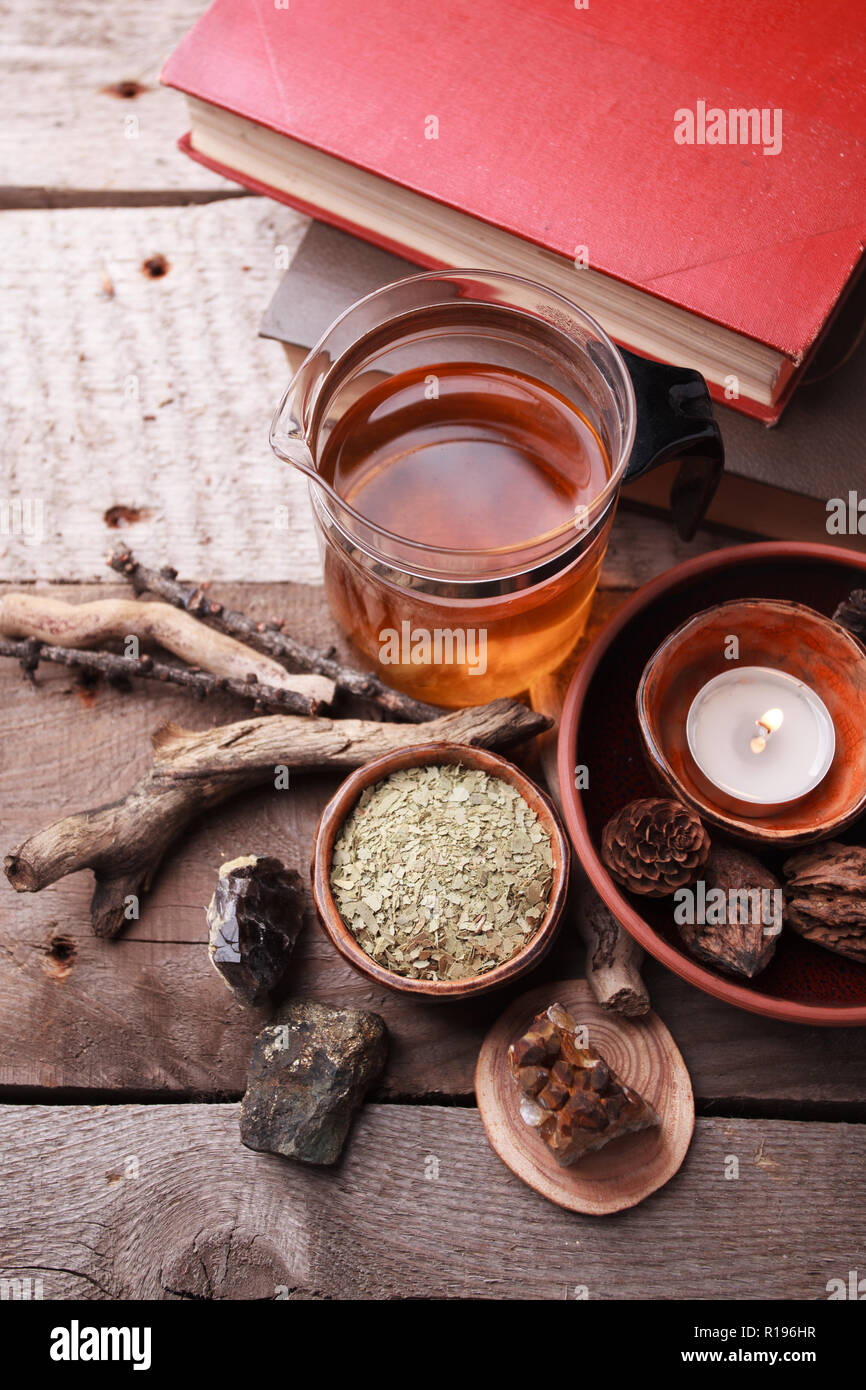 mystic still life with old book, amulets, stone, bottles. Witchcraft ...