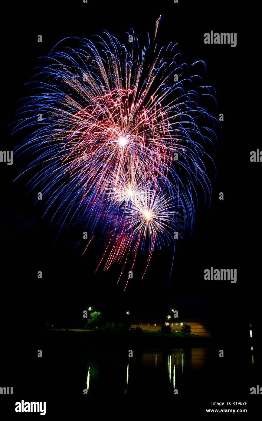 Enjoying July 4th night over the lake Stock Photo - Alamy