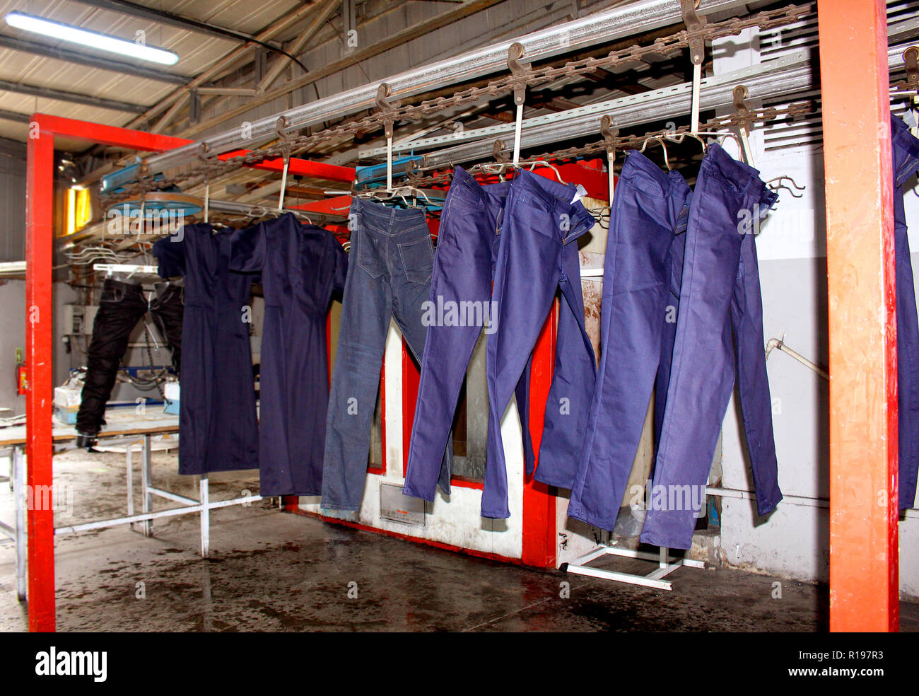 A washing machine with an old washing machine and jeans pants Stock ...
