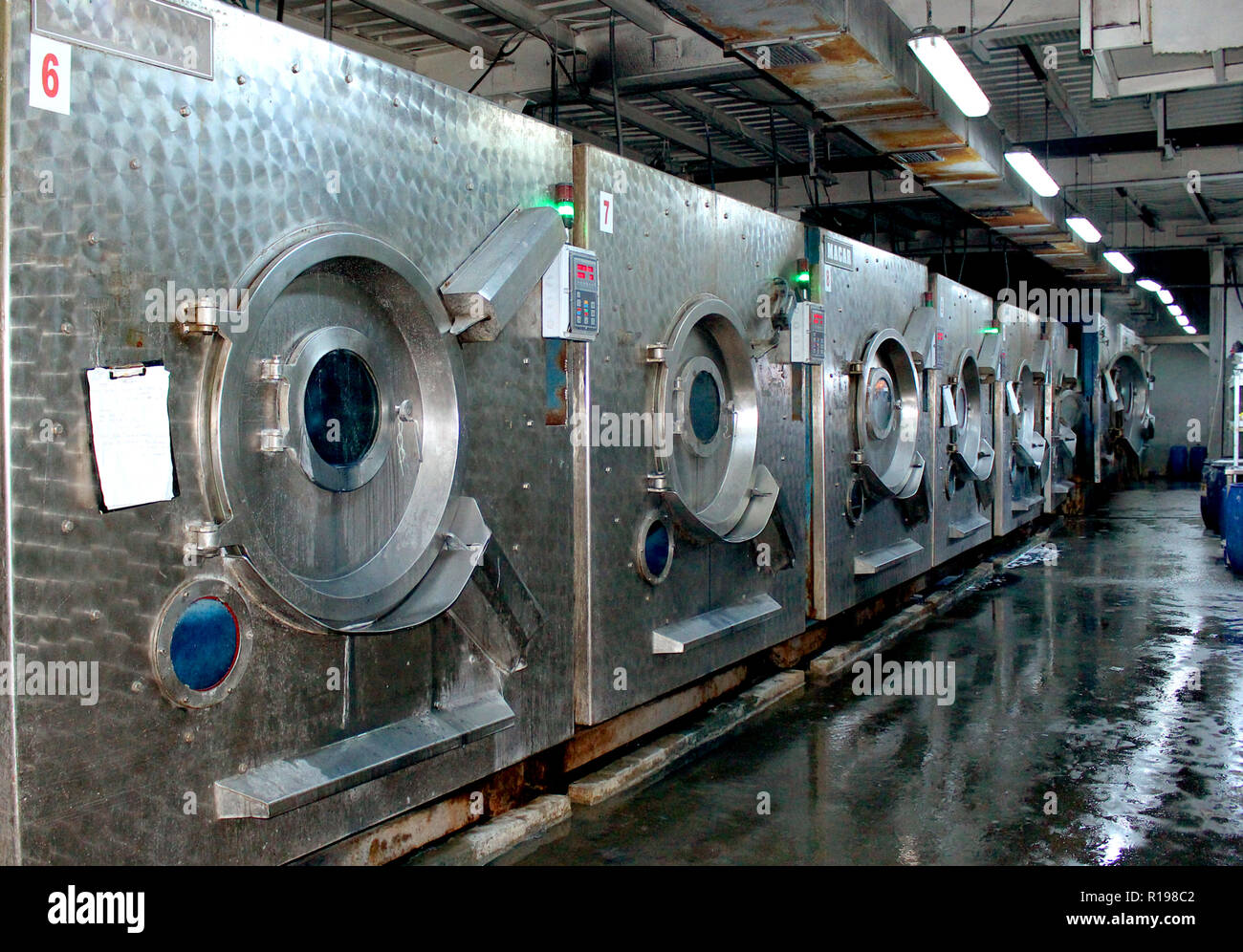 Deserted workshop of sewing and old washing machines Stock Photo - Alamy