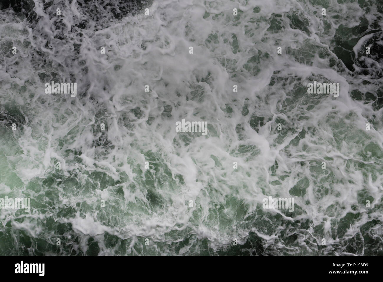 Big water splash seen from above a boat Stock Photo - Alamy