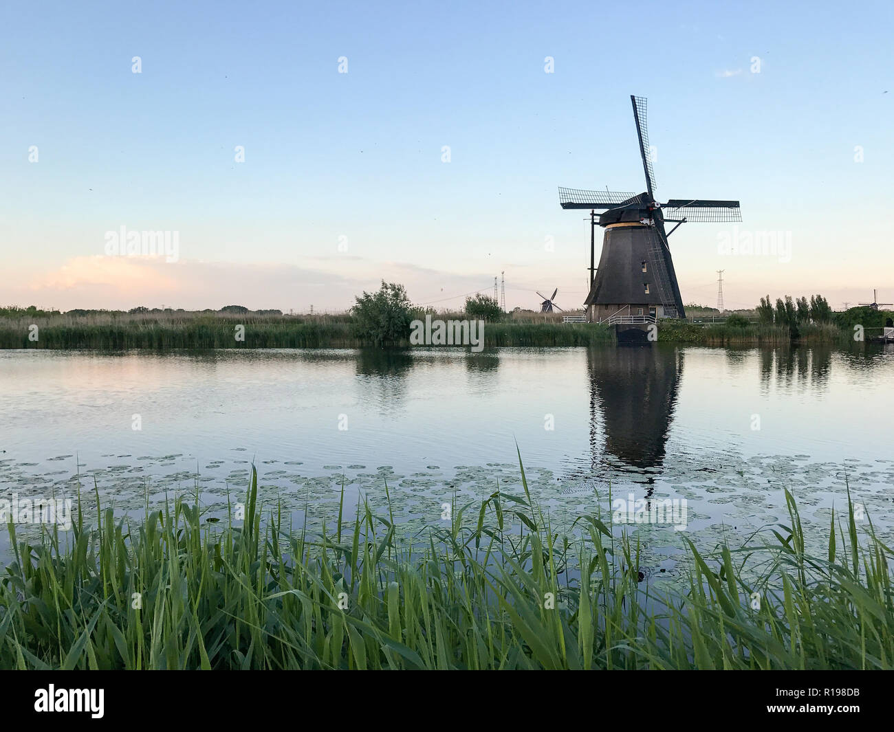 Beautiful dutch windmill landscape at the famous Kinderdijk canals ...