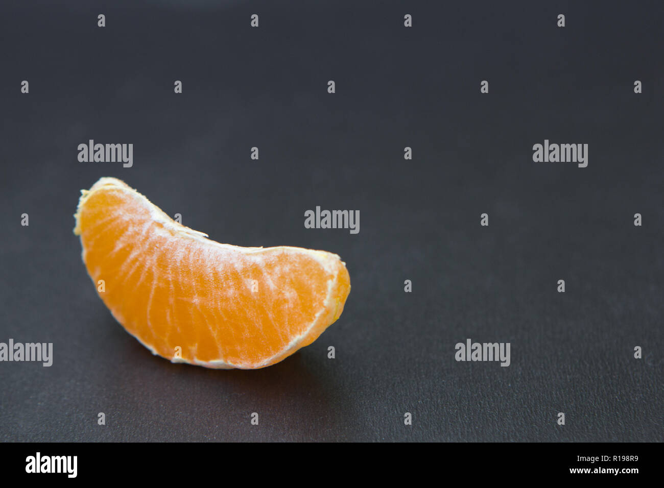 bright orange mandarin slice top view isolated on grey background Stock ...