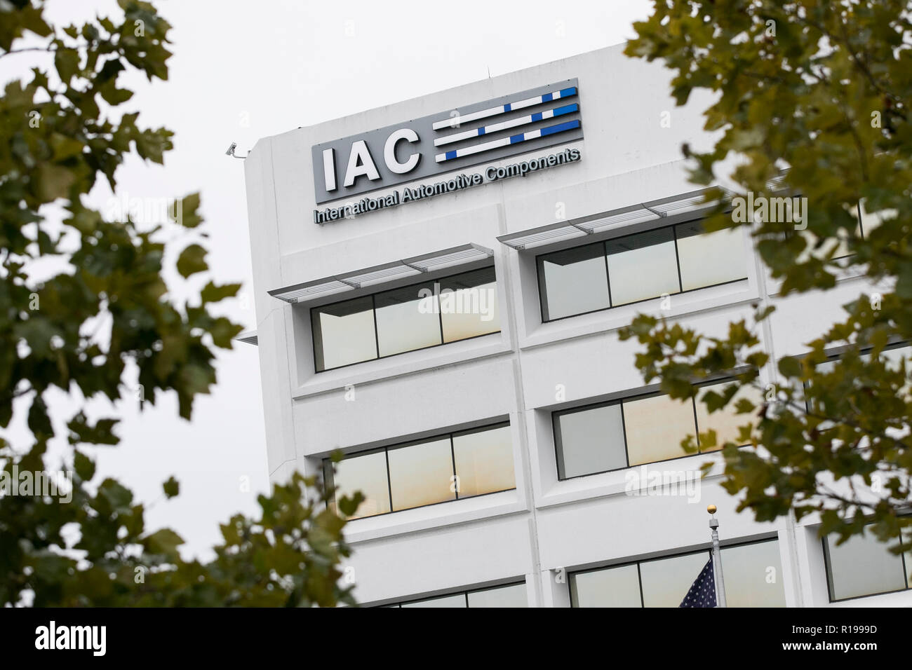 A logo sign outside of a facility occupied by International Automotive Components Group (IAC) in ...
