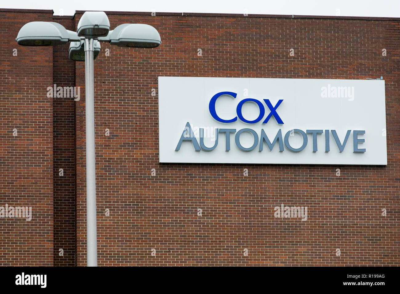 A logo sign outside of a facility occupied by Cox Automotive in Troy ...