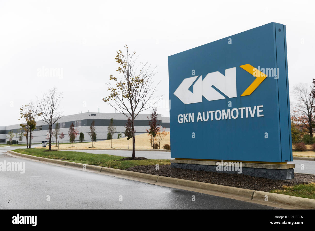 A logo sign outside of a facility occupied by GKN Automotive in Auburn ...