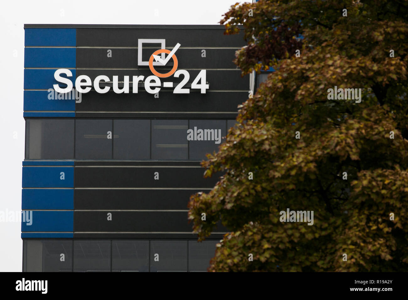 A logo sign outside of the headquarters of Secure-24, Inc., in ...