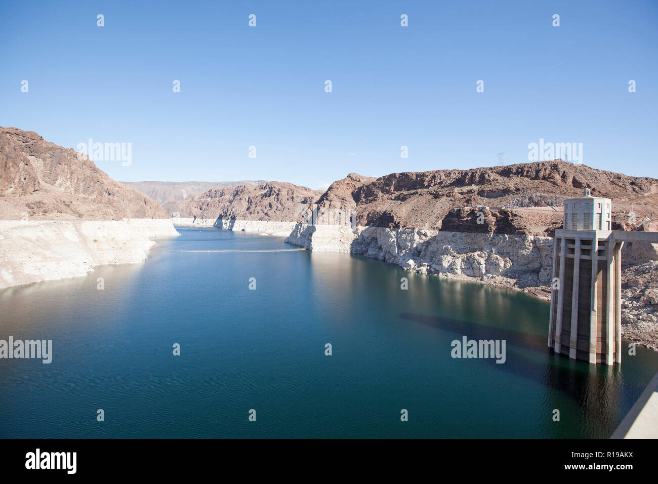 View of Lake Mead behind Hoover Dam and the water towers. The cliffs discoloration shows how ...