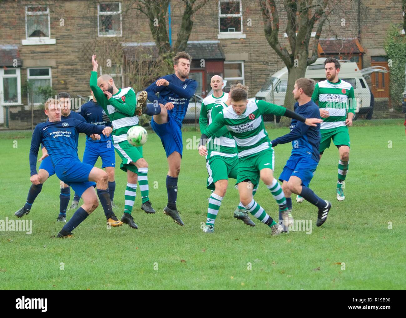 Football action from an amateur match between Blazing Rag and Dronfield ...