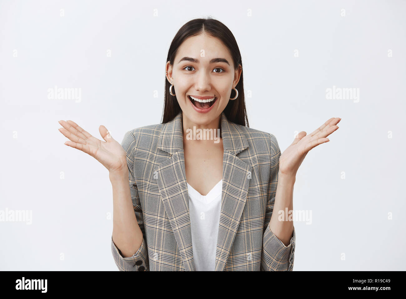 Girl surprised with incredible news, grinning and celebrating, cheering ...