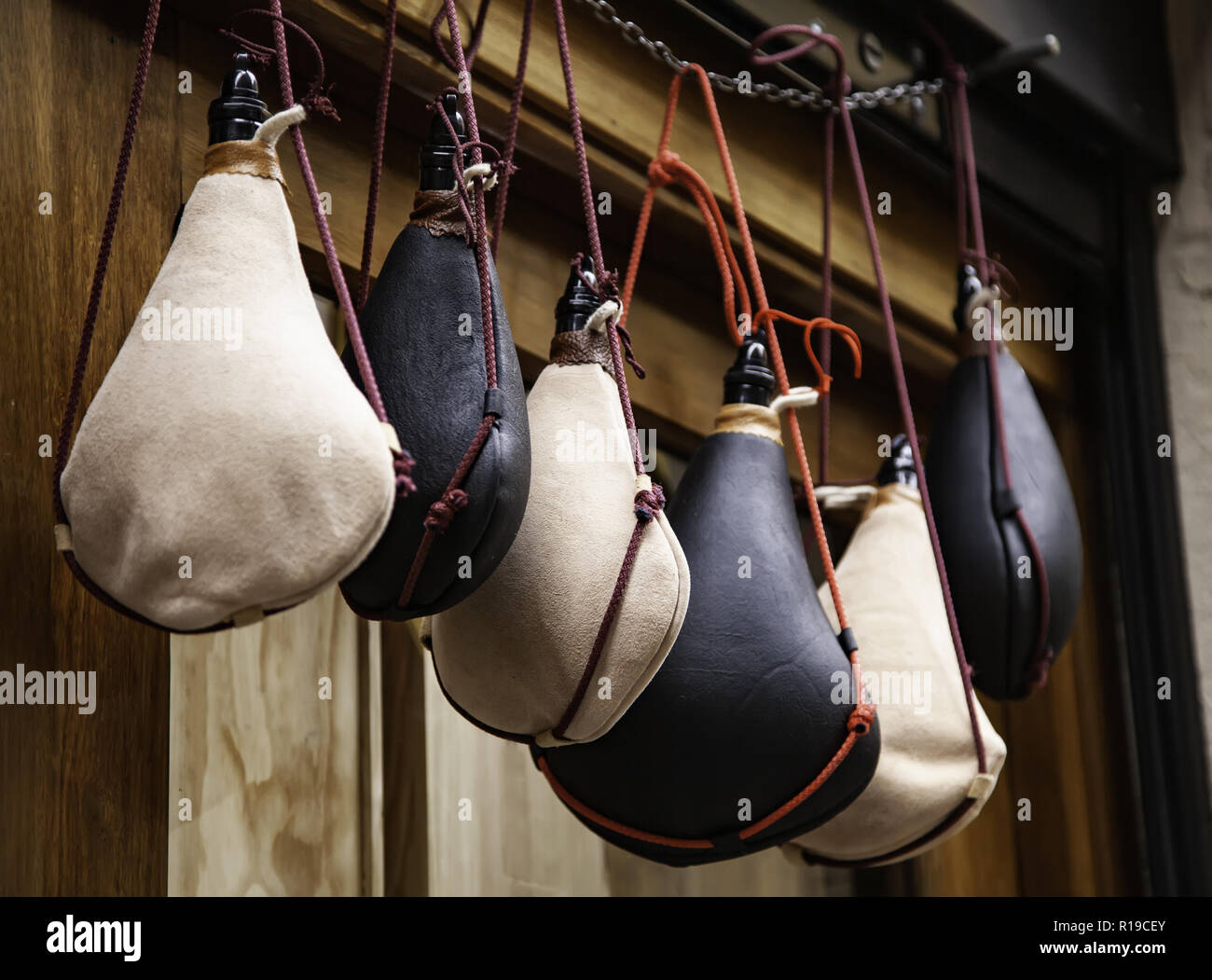 Leather wine boots, transport for alcoholic drink Stock Photo - Alamy