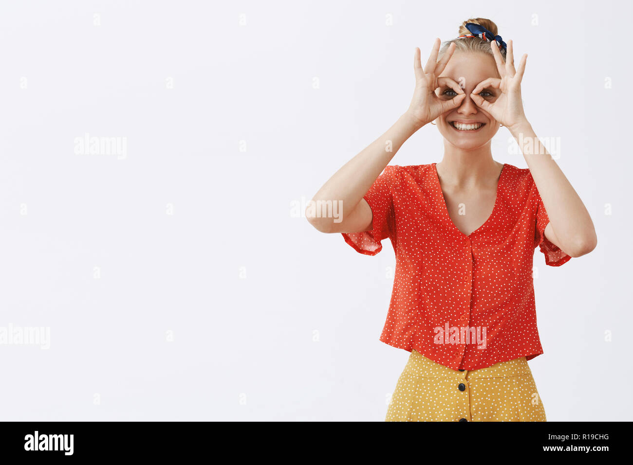 Inner kid wants play. Childish and playful good-looking happy blond ...